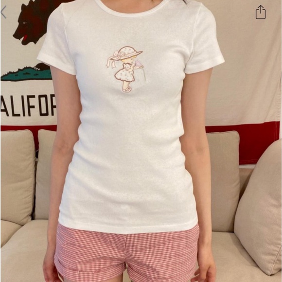 Brandy Melville | Tops | Brandy Melville Hailie Girl And Flower Top ...